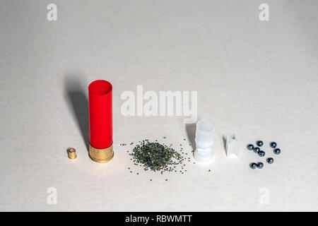 Casings, gunpowder, shot capsules on light background Stock Photo - Alamy