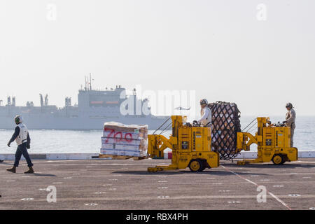 The U.S. Navy attack cargo ship USS Arneb (AKA-56) in Antarctica during ...