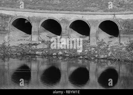 A beautiful view of reflection of round culvert on water Stock Photo ...