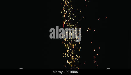 hot sparks slowly falling from above black background, wide photo Stock ...