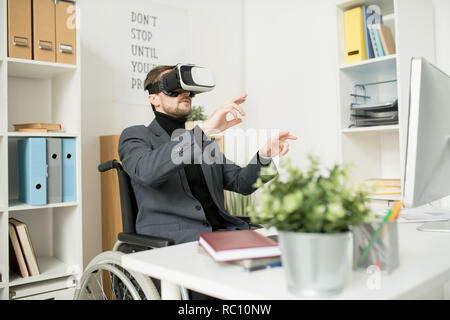 Disabled man with virtual glasses Stock Photo - Alamy