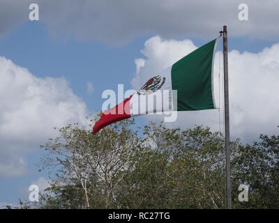 National maxican flag at Chichen Itza city near famous archaeological ...