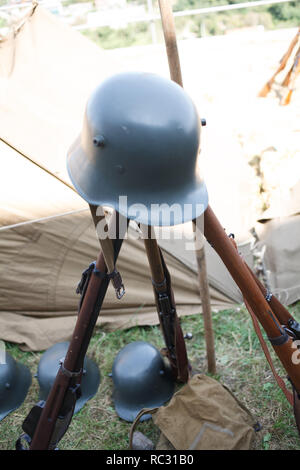 Rifles pyramids with ammunition and german steel helmet, First World ...