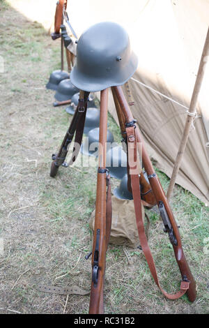Rifles pyramids with ammunition and german steel helmet, First World ...