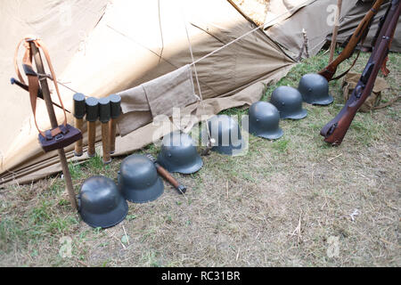 Rifles pyramids with ammunition and german steel helmet, First World ...