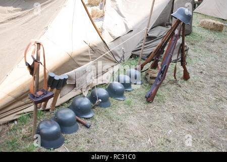Rifles pyramids with ammunition and german steel helmet, First World ...