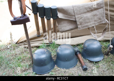 Rifles pyramids with ammunition and german steel helmet, First World ...