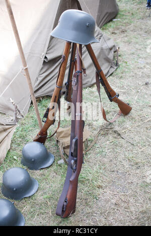 Rifles pyramids with ammunition and german steel helmet, First World ...