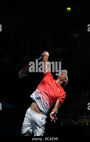 Kevin Anderson, of South Africa, serves to Jenson Brooksby during a ...