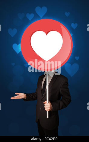 Smart businessman holding round sign with heart Stock Photo - Alamy