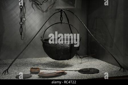 Group of Viking utensils. Chain for cauldron and iron cauldron with ...