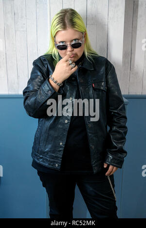 Alma, pop singer from Finland, poses for photographs in the lobby of a ...