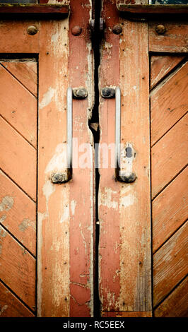 Old wooden door with vintage metal frame pattern Stock Photo - Alamy