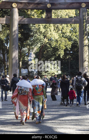 Japanese girls dressed in colorful kimonos are seen at Meiji Jingu ...