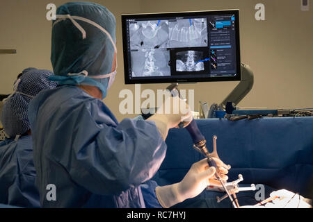 A modern operating room, surgeons and doctors doing an oncological ...