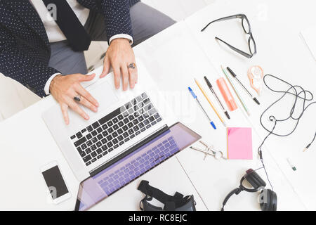 Cropped view of interior designer using smartphone and holding color ...