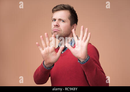 Male shows refusal gesture, does not want to participate in christmas ...