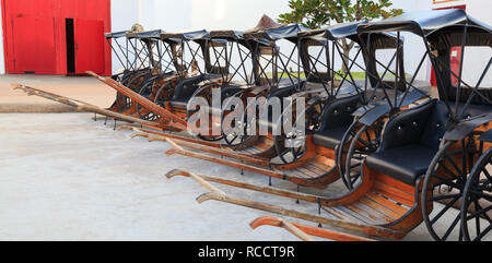 A pulled rickshaw, a mode of human-powered transport by which a runner ...