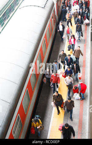 Passengers boarding / disembarking from a train of the Indian railways ...