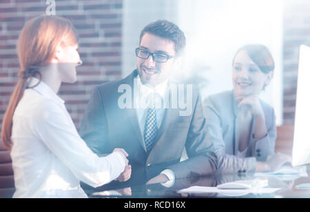 friendly handshake between colleagues in the office Stock Photo - Alamy