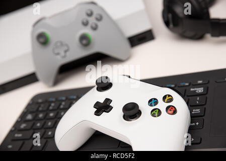 Gaming console and wireless controllers. Video game concept Stock Photo ...