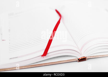 Picture of diary with pencil. Isolated on the white background Stock ...
