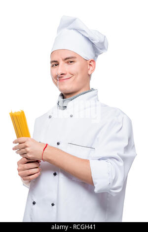 Handsome man cooking italian spaghetti pasta at the kitchen happy face ...