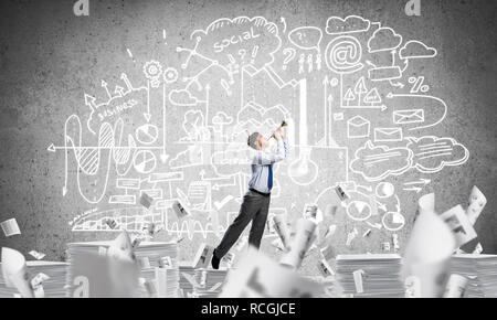Happy businessman playing fife Stock Photo - Alamy