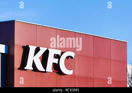 Exterior of KFC Kentucky Fried Chicken fast food restaurant with drive ...
