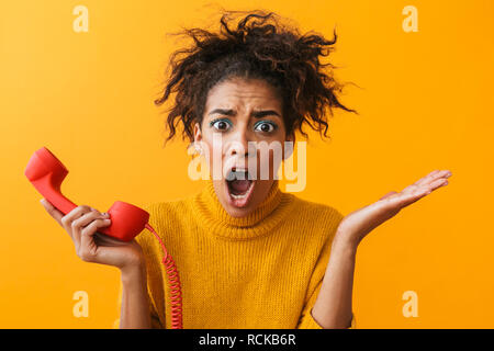 Photo of brunette shocked afro american girl point empty space promo ...