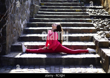 Little flexible girl splitting legs apart Stock Photo - Alamy