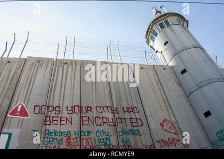 An Israeli watch tower on the separation wall faces a residential ...