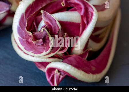 foreground of the tips of the leaves of a Treviso radicchio, vegan and ...