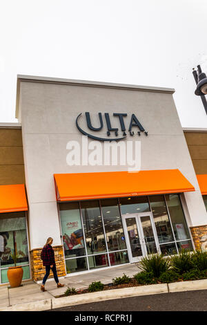 A logo sign outside of a Ulta Beauty retail store location in American ...