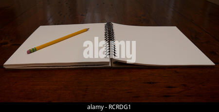 Composition with open book on the table Stock Photo - Alamy