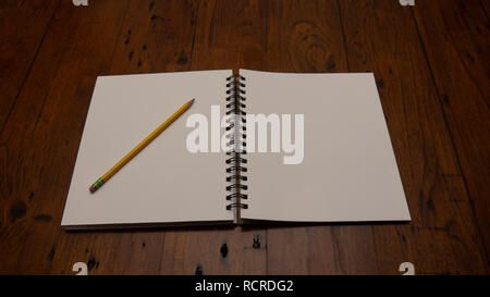 Composition with open book on the table Stock Photo - Alamy