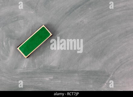 Back to school concept with green erased chalkboard Stock Photo - Alamy