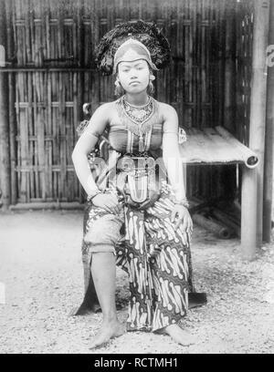 Female Javanese dancer, full-length portrait, seated, in costume, Paris ...