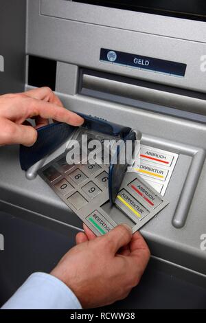 Seized equipment for skimming, tampering with ATMs, fake keyboard, card ...