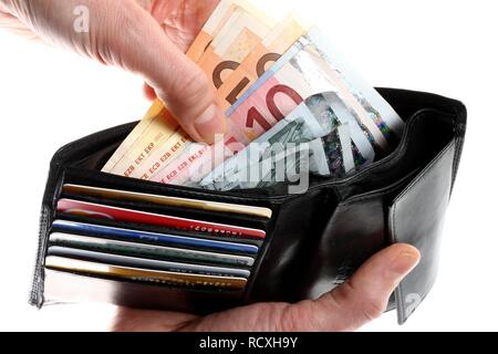 Male hands with wallet and credit cards in office, closeup Stock Photo ...