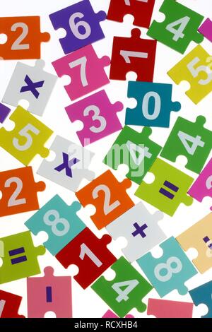 Numbers puzzle with math symbols Stock Photo - Alamy