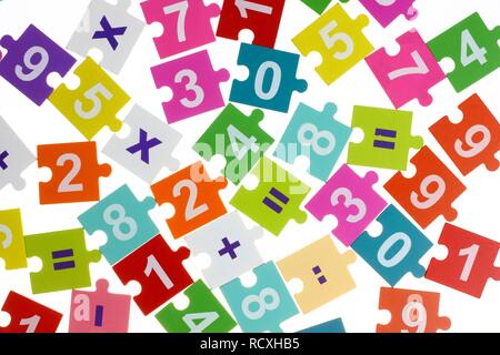 Numbers puzzle with math symbols Stock Photo - Alamy