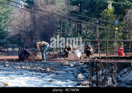Repairing a footover bridge at Kasol. This joins the Chalal and Rashol ...