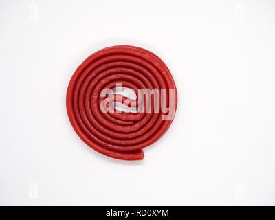 Red licorice on white background Stock Photo - Alamy
