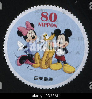 The Minnie Mouse and Pluto cartoon character at the flower and garden ...