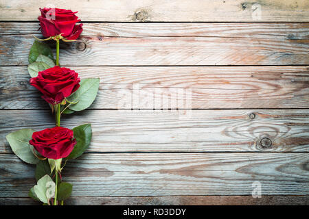 Red roses bouquet on rustic wooden background with copy space Stock ...