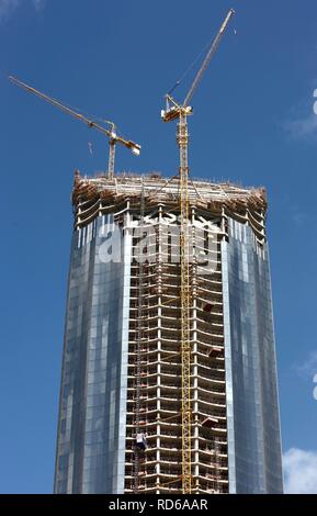 A high angle closeup shot of houses in the countryside with horses ...