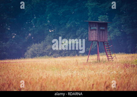 Wooden Hunters hunting tower in countryside landscape, Fall autumn ...