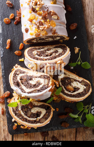 Top view of a strudel on a Christmas plate near cinnamon sticks ...