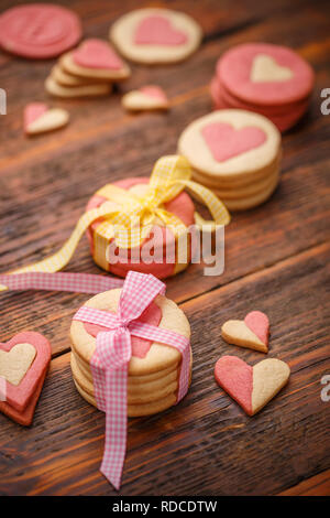 Sweet cookies tied with pink ribbon isolated on white Stock Photo - Alamy